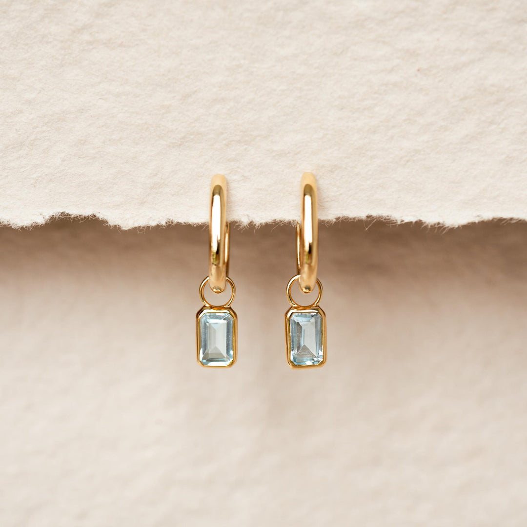 Huggie Earrings with Baguette Charms Sky Blue Topaz - Amelia | Linjer ...